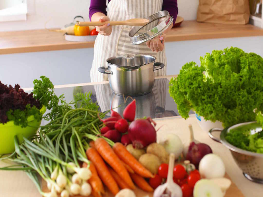 woman cooking - can stock photo - Green Queen